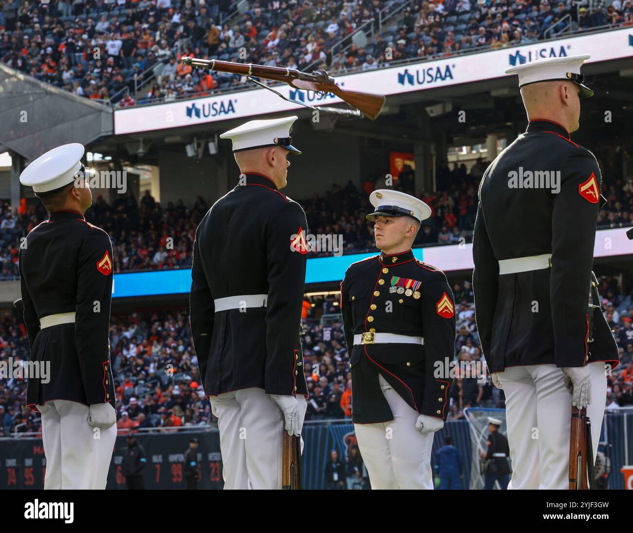Marines with the U.S. Marine Corps Silent Drill Platoon execute their ...