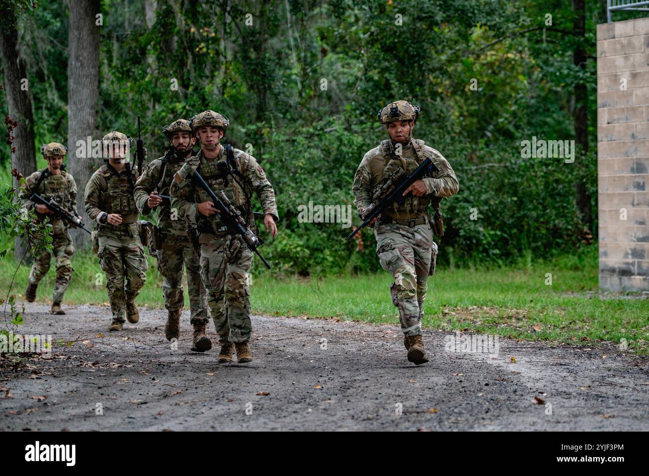 U.S. Air Force Airmen assigned to the 820th Base Defense Group run in ...