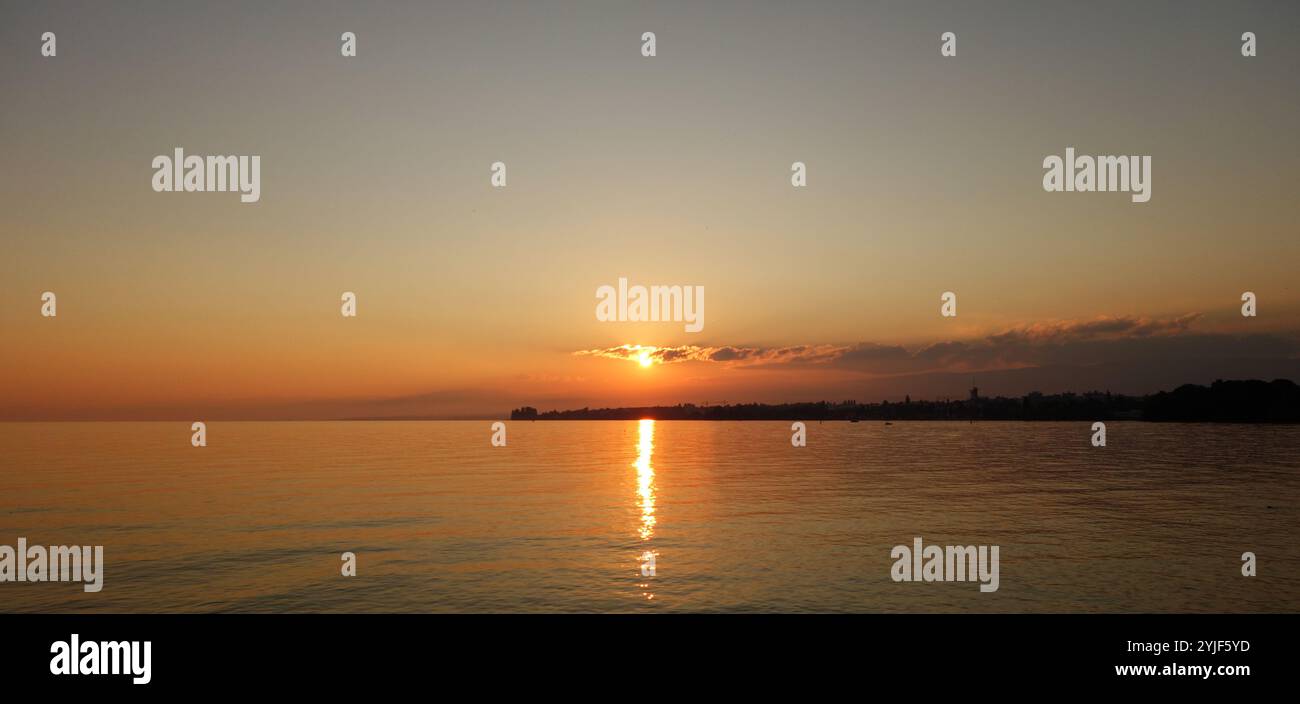 Sun sunset reflected on sea hi-res stock photography and images - Alamy