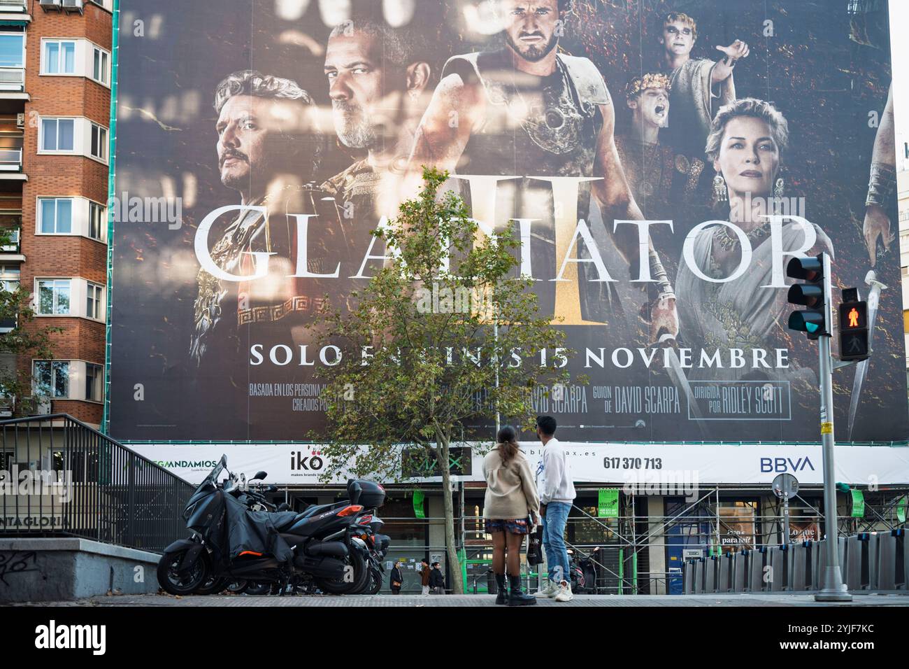 A large advertisement billboard promoting the movie Gladiator II ...