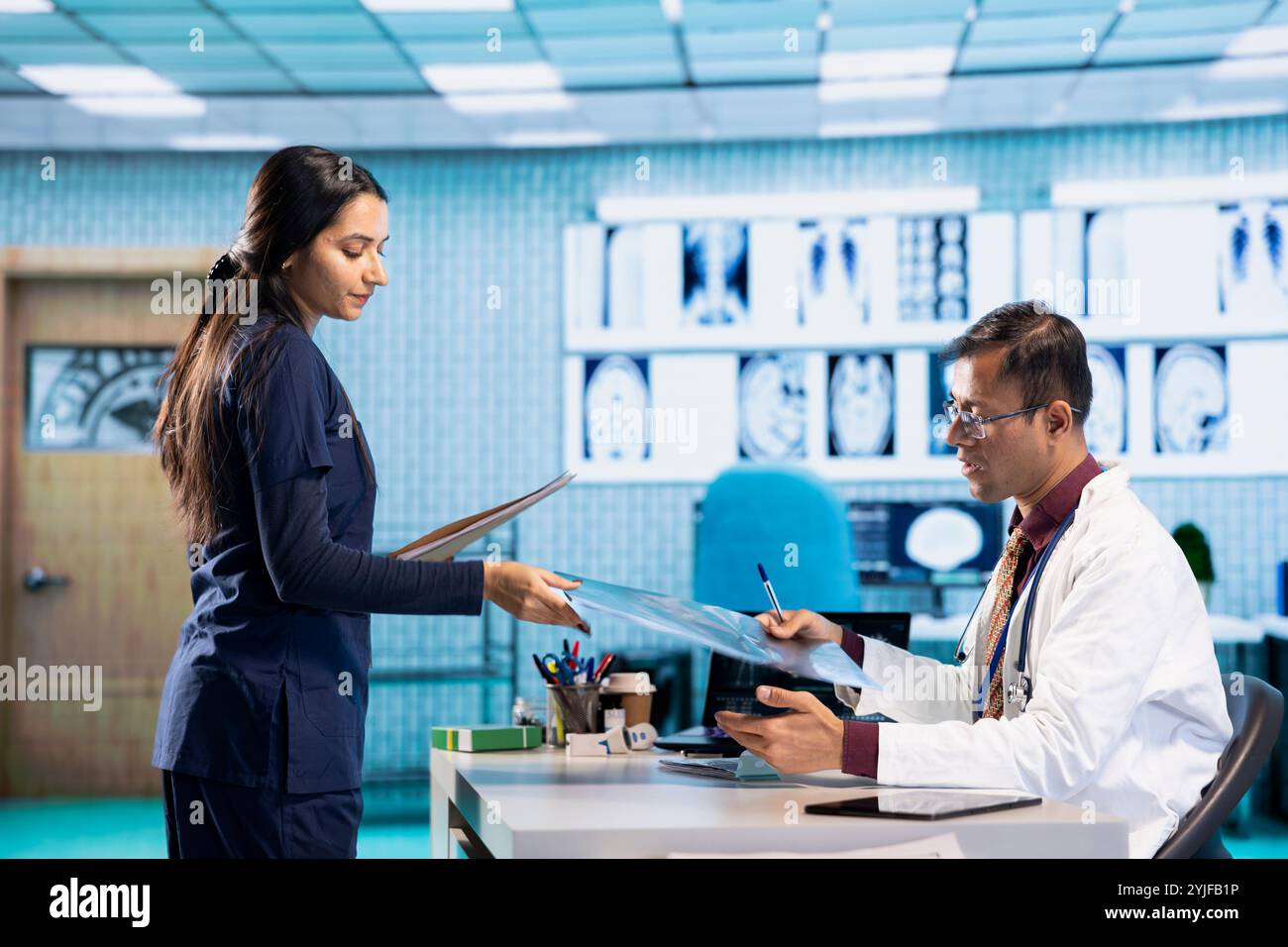 Indian expert explaining diagnostics through test results with a male ...