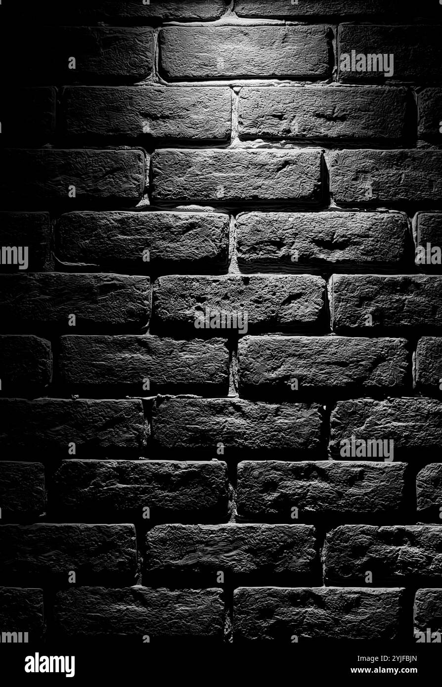 Illuminated Brick Wall at Night: A Play of Light and Shadow. Black and ...