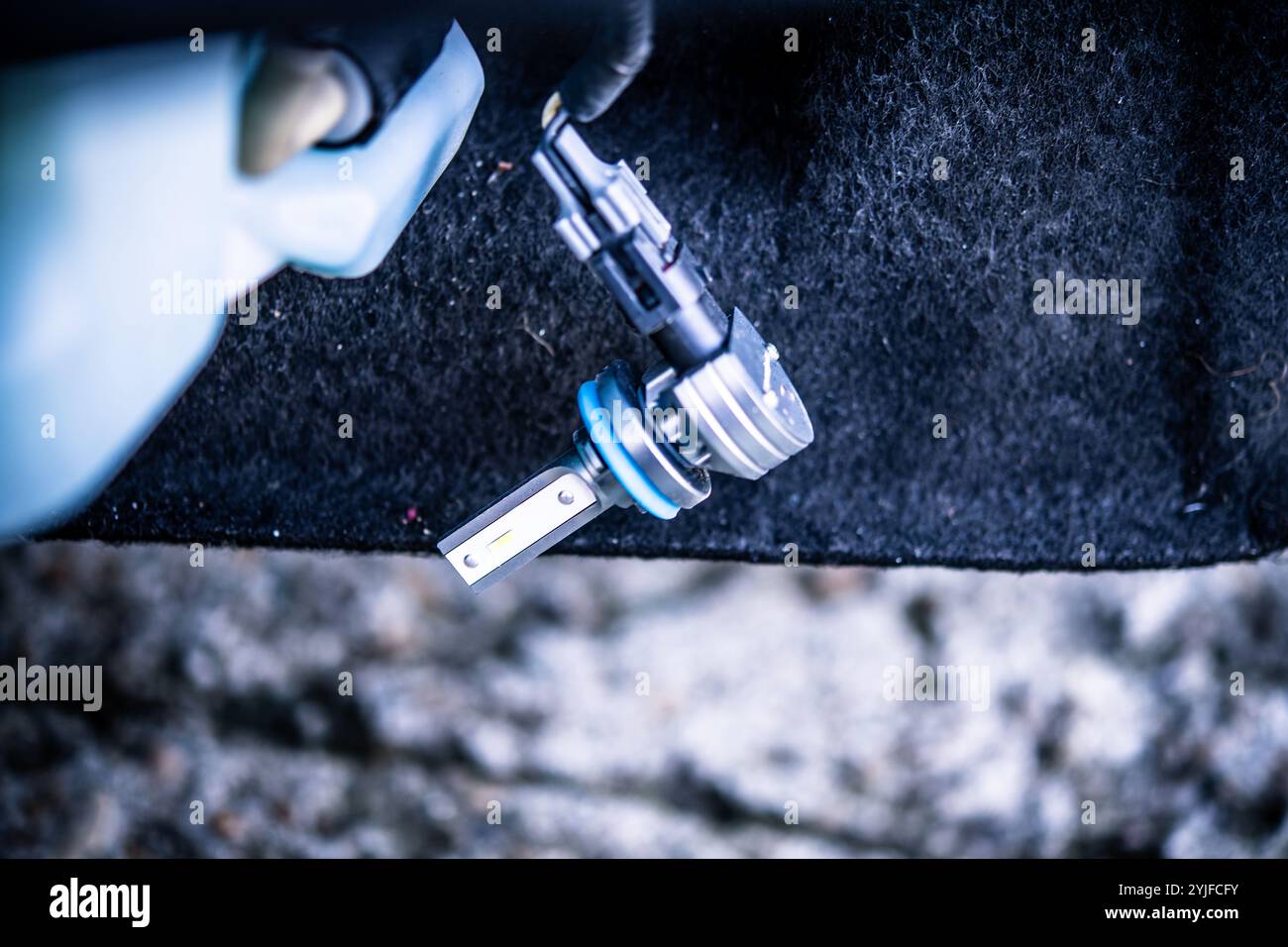 Car light bulb revealed post-accident, emphasizing vehicle repair and ...