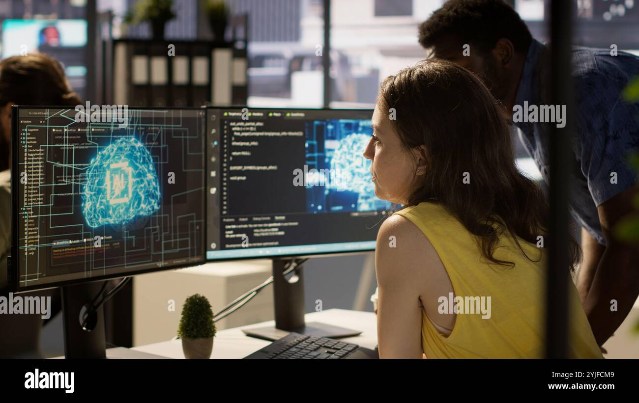 Employee using AI technology to design algorithms that enable machines ...
