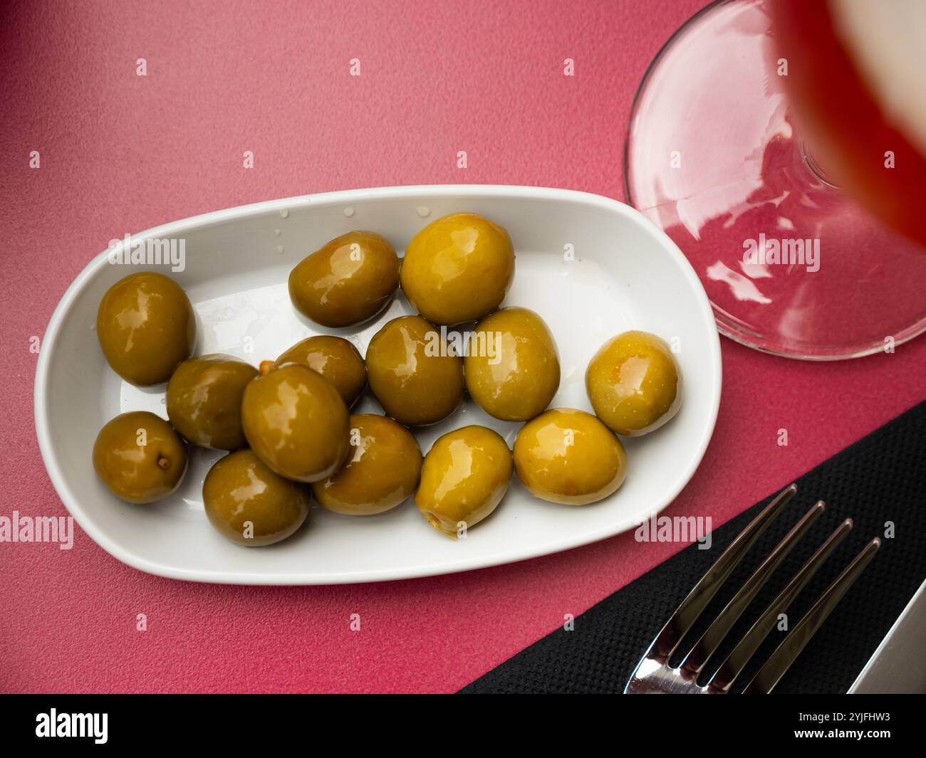 Spanish tapas from marinaded green olives at plate Stock Photo - Alamy