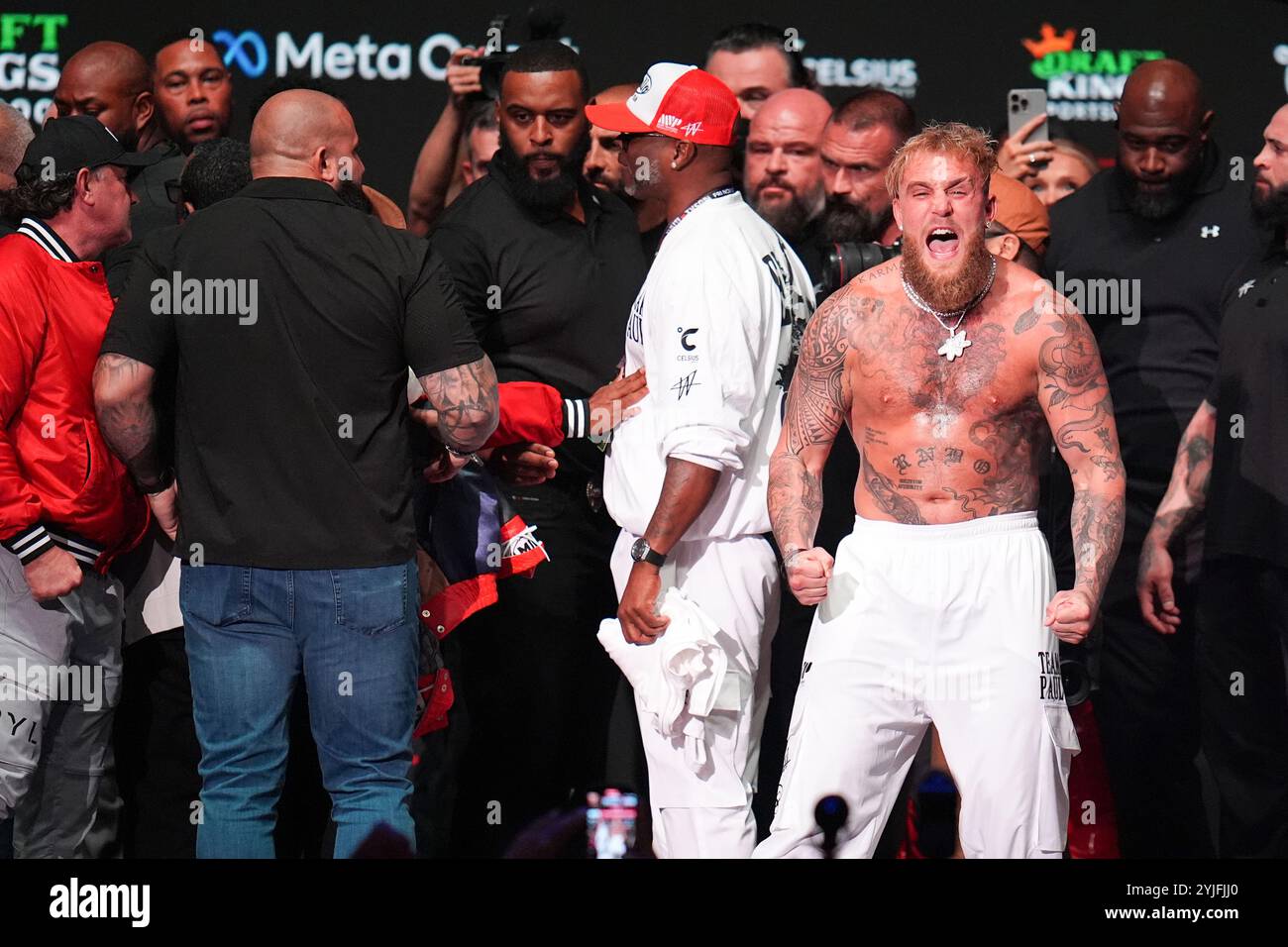 Jake Paul reacts after being slapped by Mike Tyson during a weigh-in ...