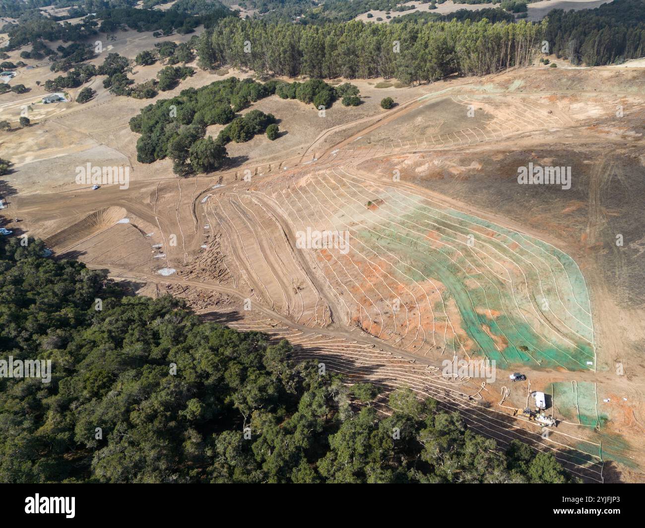 A valley with construction happening in it in California, USA seen from ...