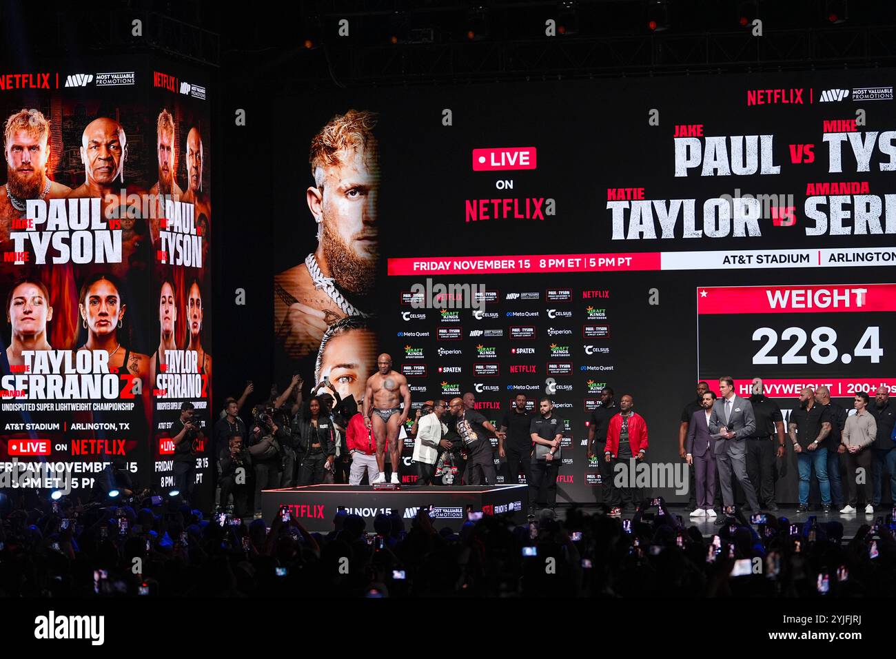 Mike Tyson steps on the scale during a weigh-in ahead of his ...
