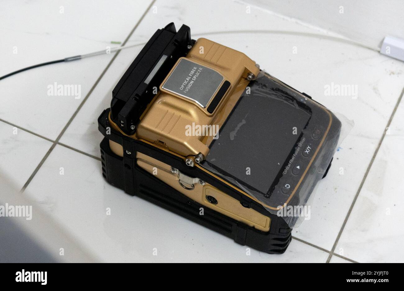 Close up of a optical fiber fusion splicer which is used to join ends ...