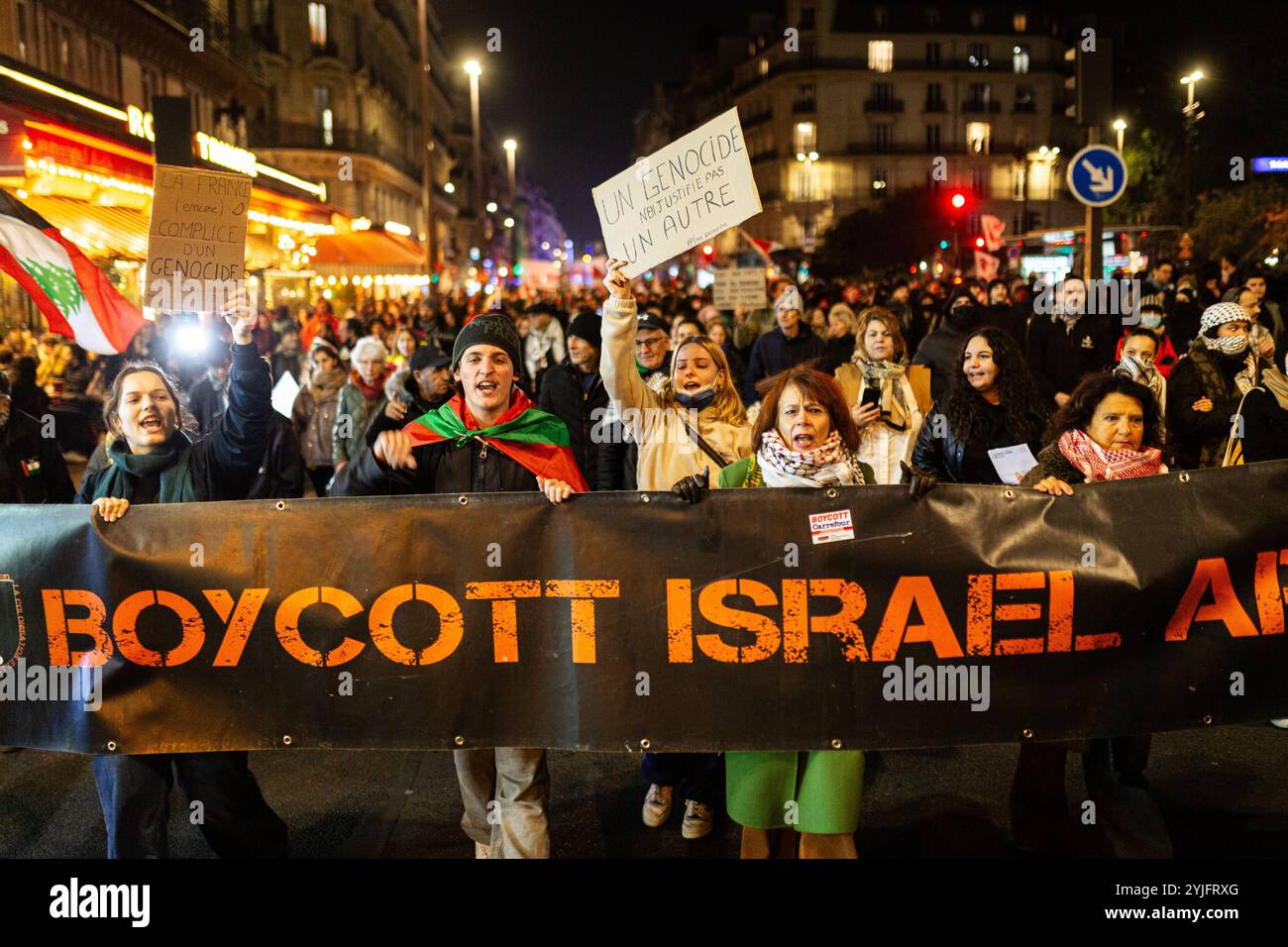 Demonstrators hold a banner that says "Boycott Israel", during the pro ...