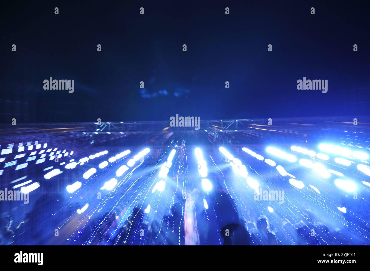 Stage lighting effect in the dark, fuzzy figure Stock Photo - Alamy
