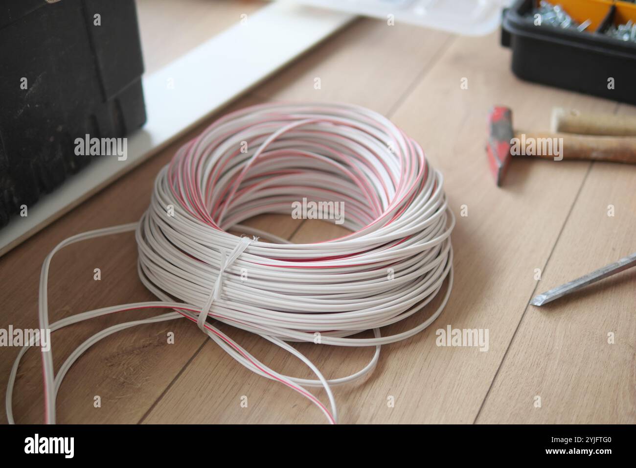 The thick white wire on floor Stock Photo - Alamy