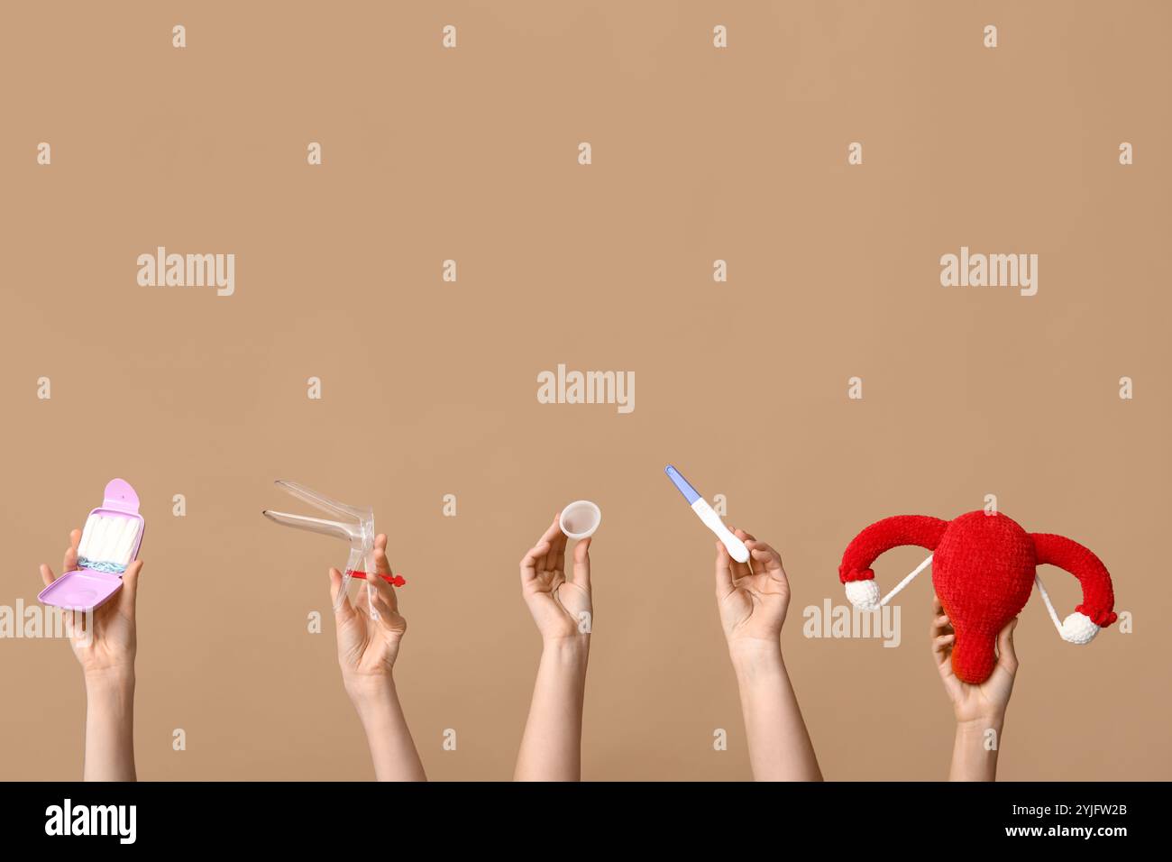 Hands with female uterus, pregnancy test, menstrual cup, tampons and ...