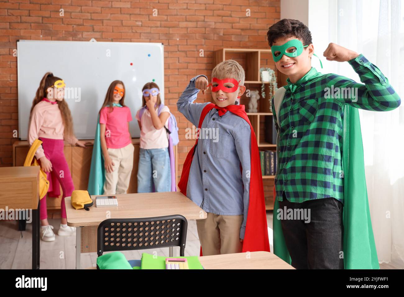 Teenage boys dressed as superheroes in classroom Stock Photo - Alamy