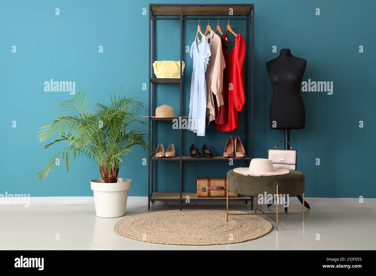 Interior of dressing room with mannequin, clothes rack and pouf Stock ...