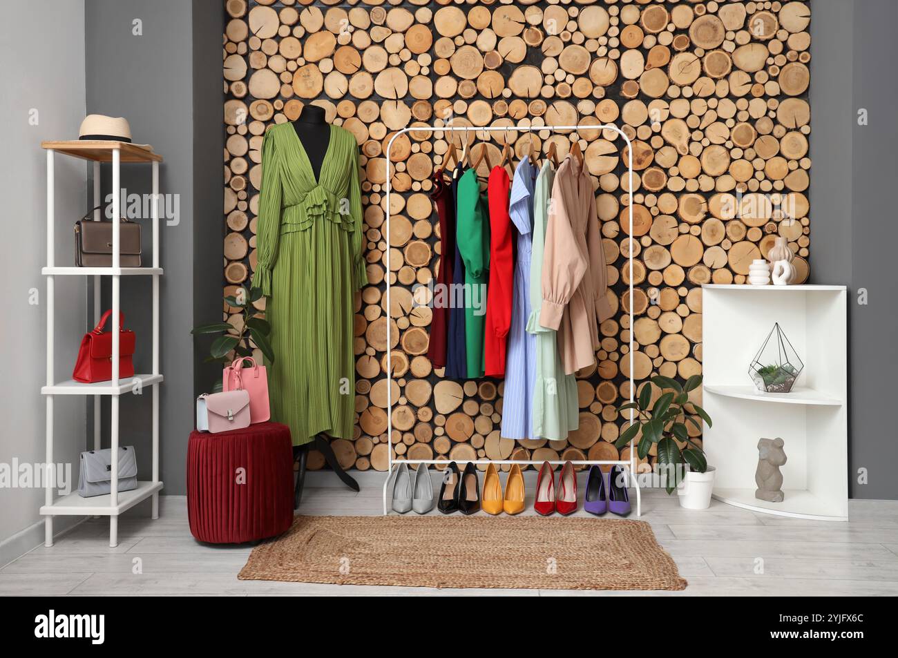 Interior of dressing room with mannequin, clothes rack and pouf Stock ...