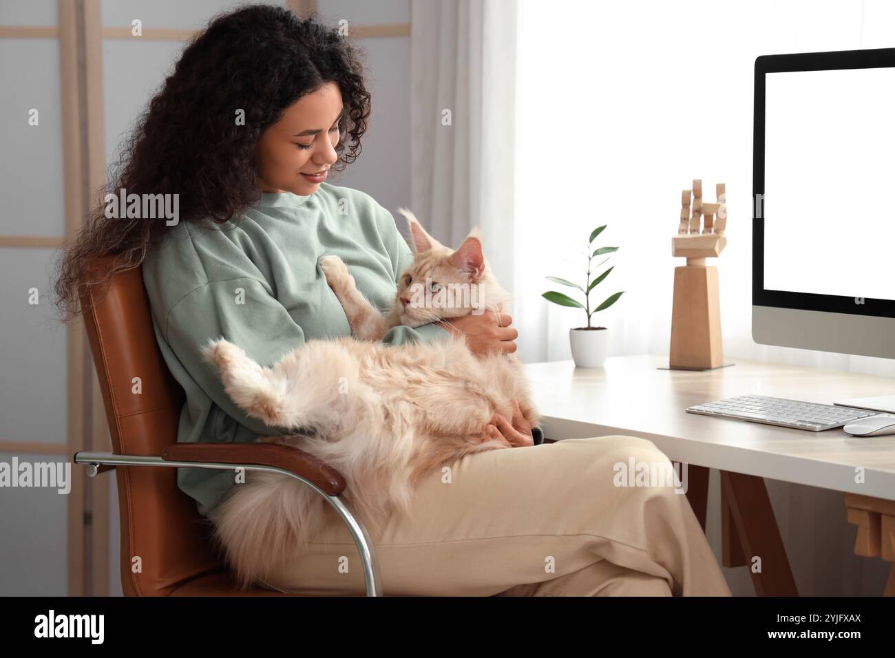 Beautiful young happy African-American woman working with her cute ...