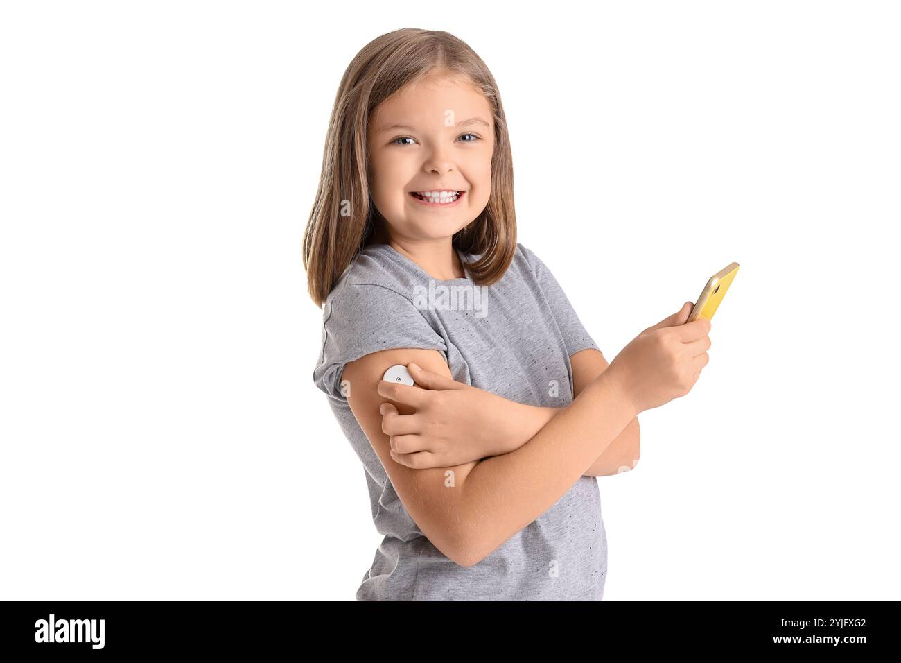 Diabetic girl with glucose sensor using mobile phone for measuring ...