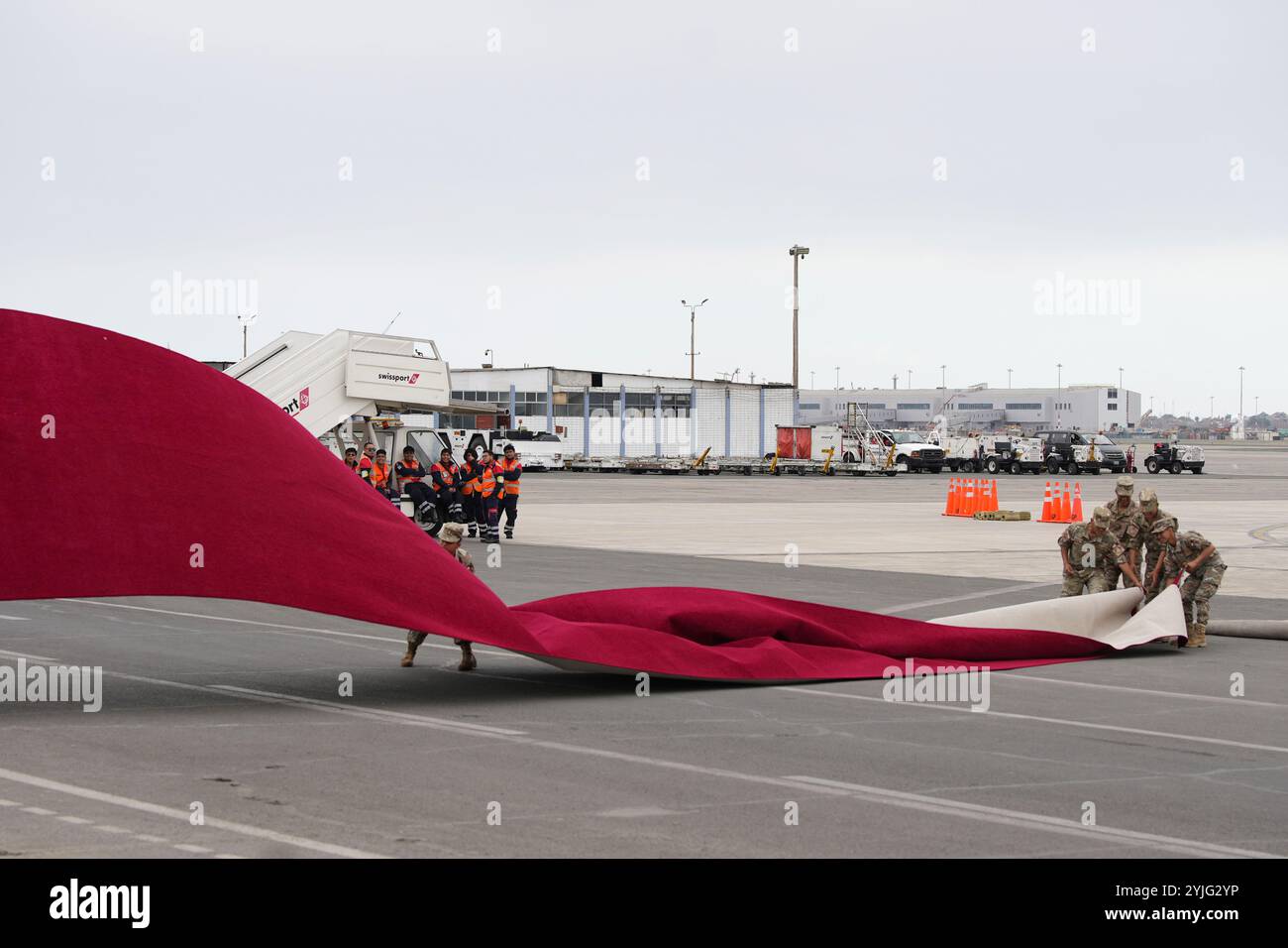 Air Force members fix the red carpet before the arrival of Vietnam's ...