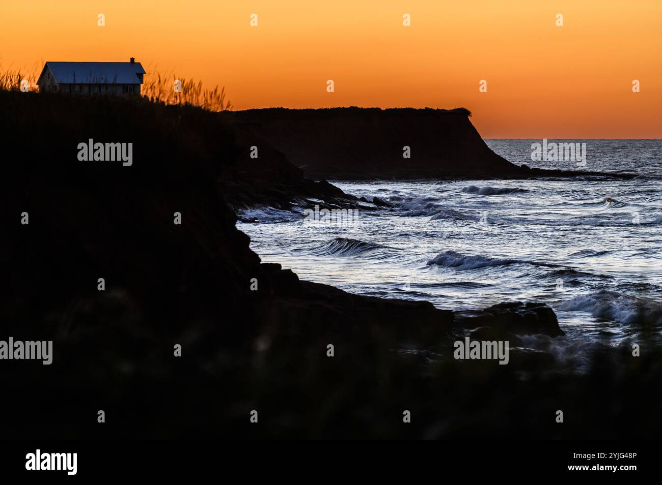 Dramatic colorful view of big sweeping view of the sea coast shore on ...