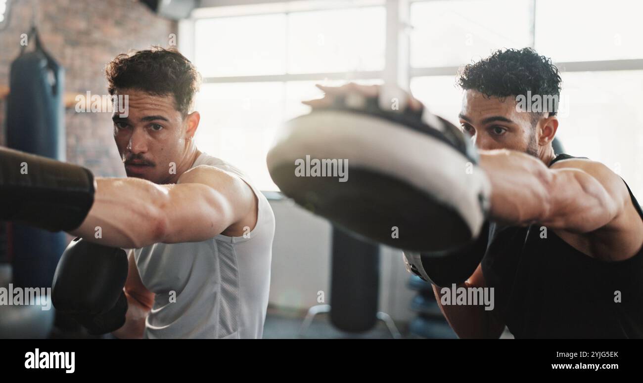 Trainer helping male boxer hi-res stock photography and images - Alamy