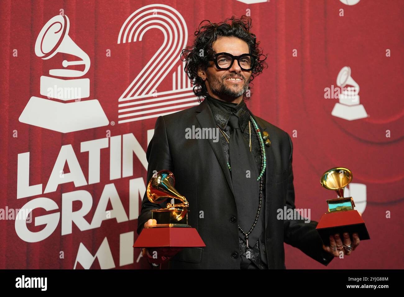 Draco Rosa poses after winning two awards at the 25th Latin Grammy ...