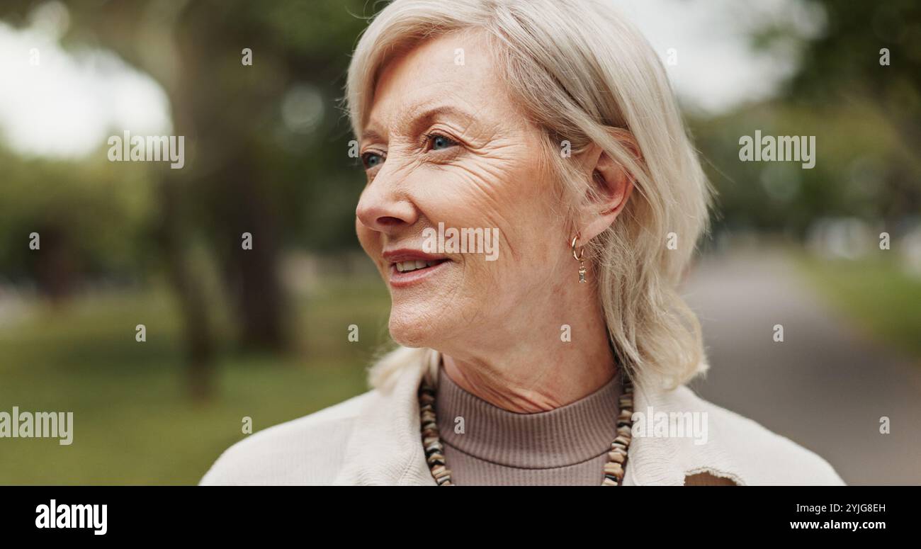 Mature woman, thinking and outdoor for memory, reflection and nostalgia ...