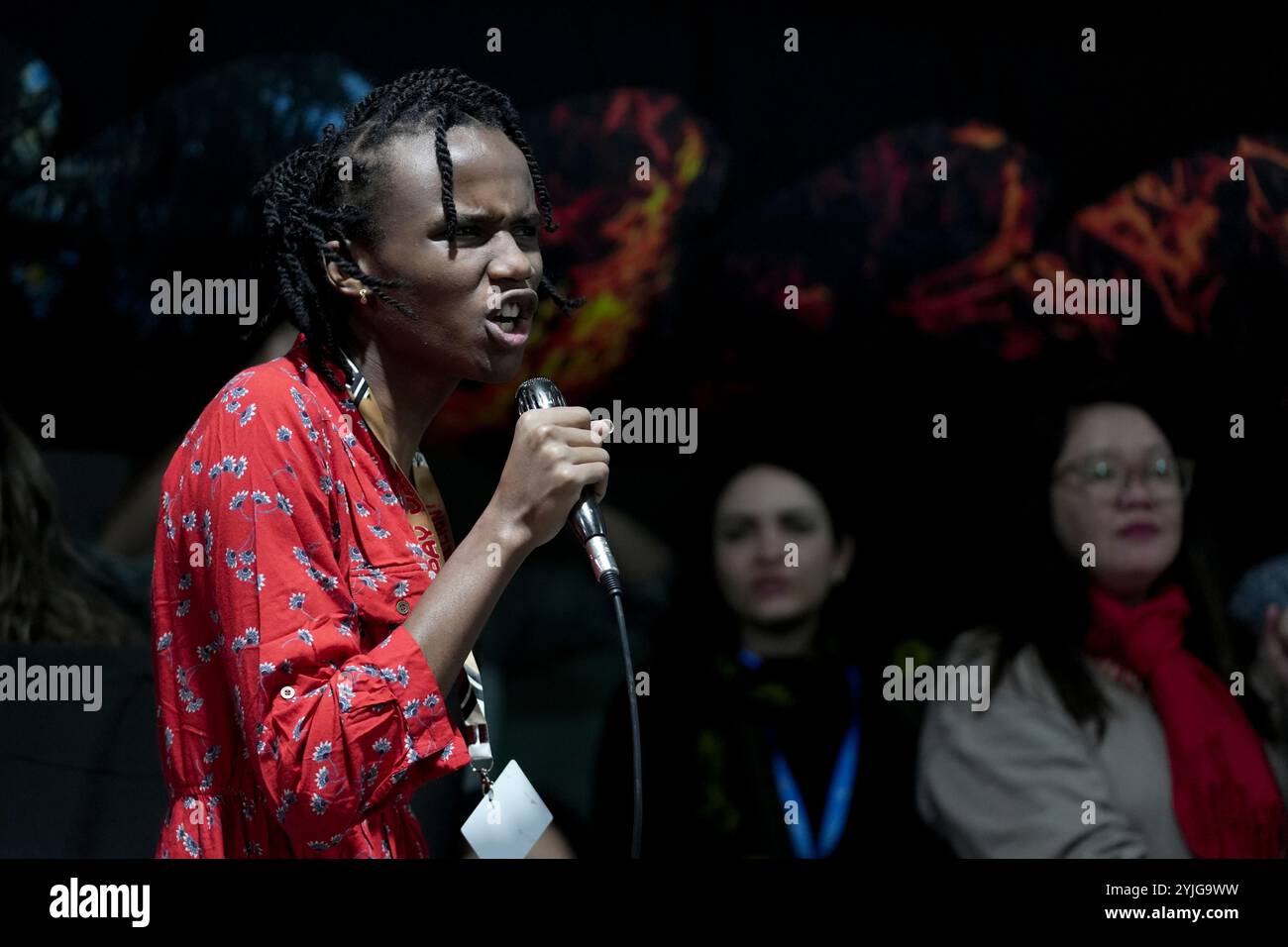 Eric Njuguna, of Kenya, participates in a demonstration against fossil ...