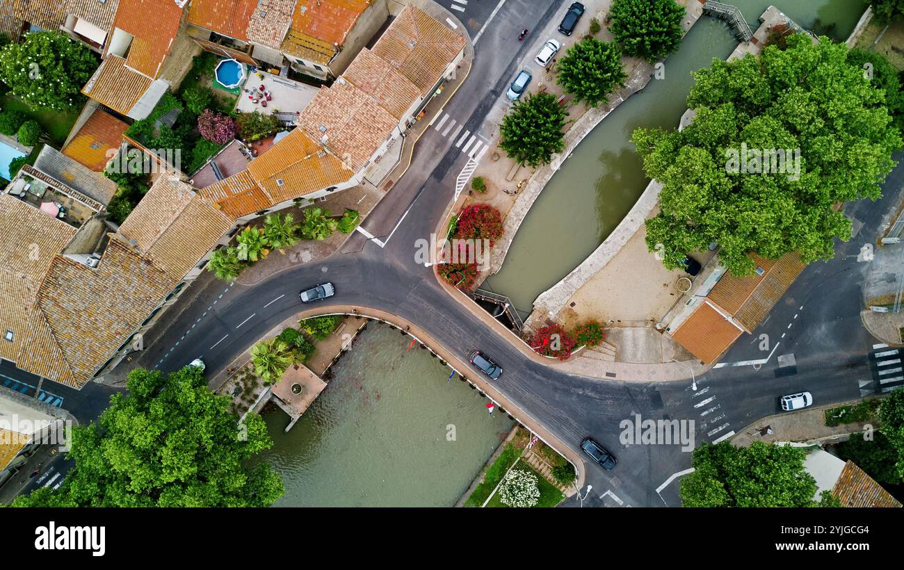 Aerial top view of boats and lock in Canal du Midi, road and bridge ...