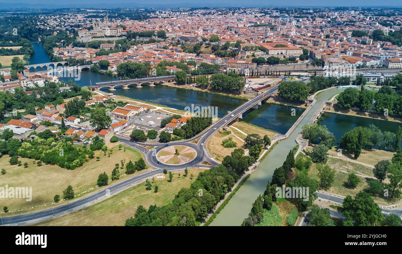 Aerial top view of Beziers town, river and bridges from above, South ...