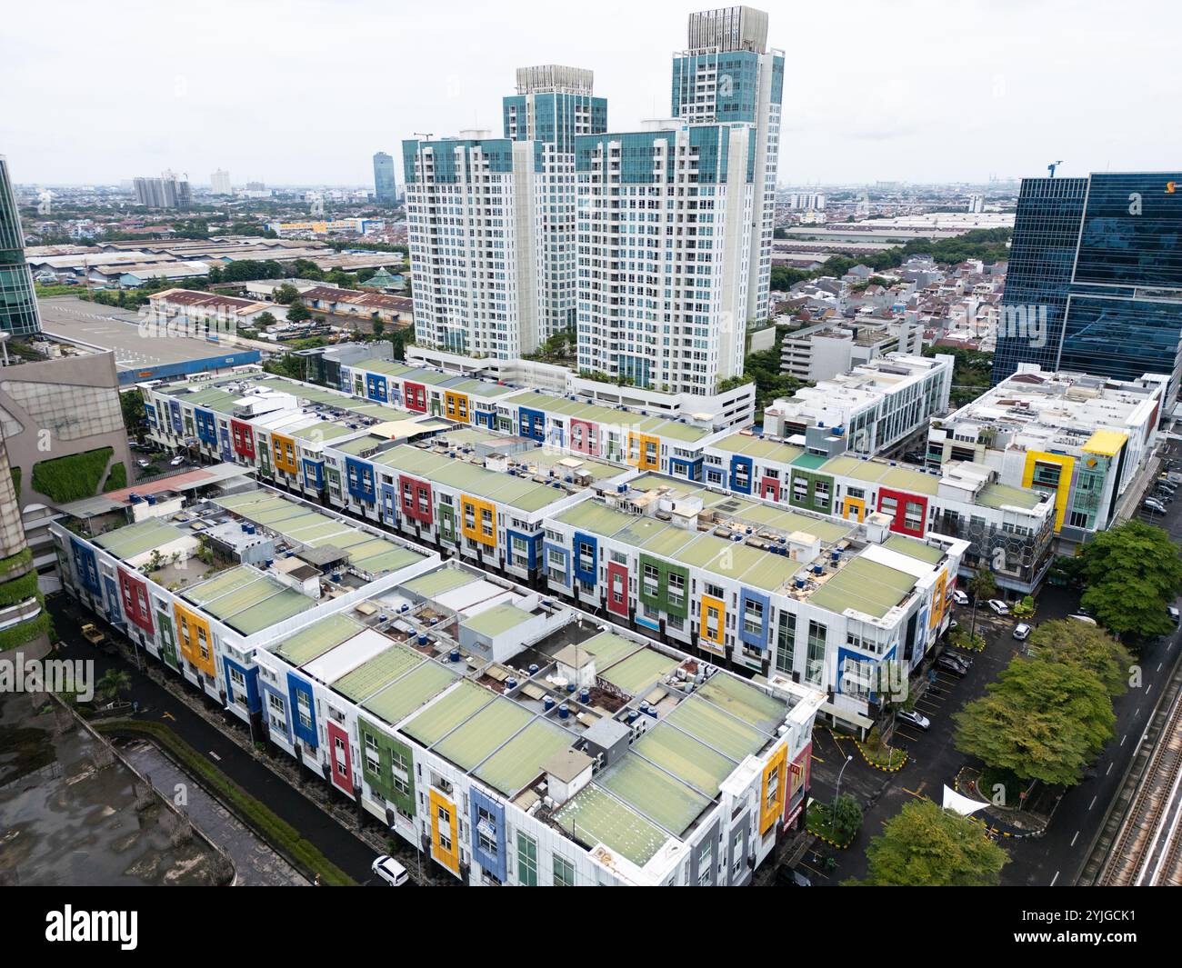 Aerial shot of vibrant, colorful apartment blocks contrasted with ...