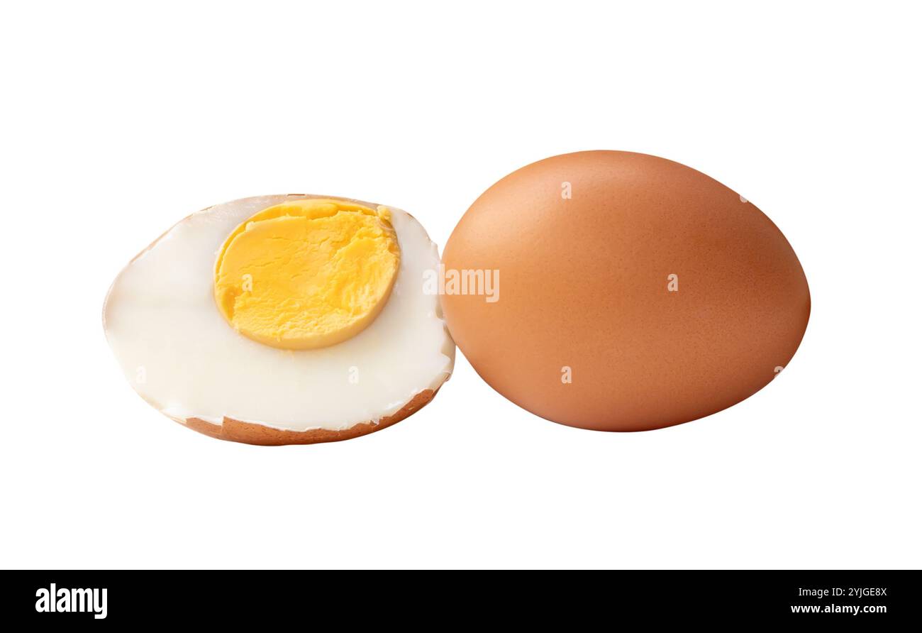 Side view of boiled or cooked brown chicken eggs with half and egg yolk ...