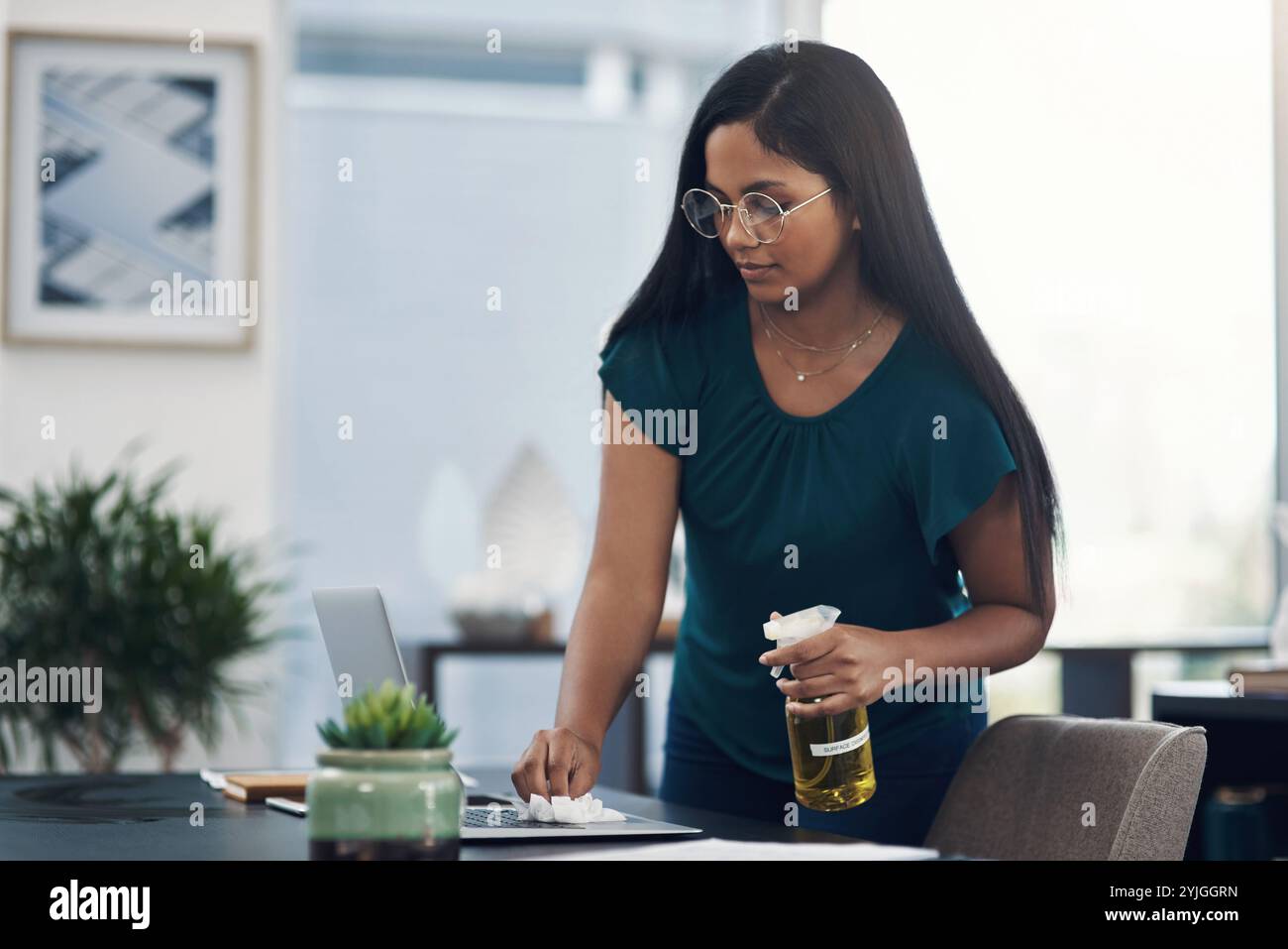 Woman, office and spray for desk hygiene, employee and disinfection of ...