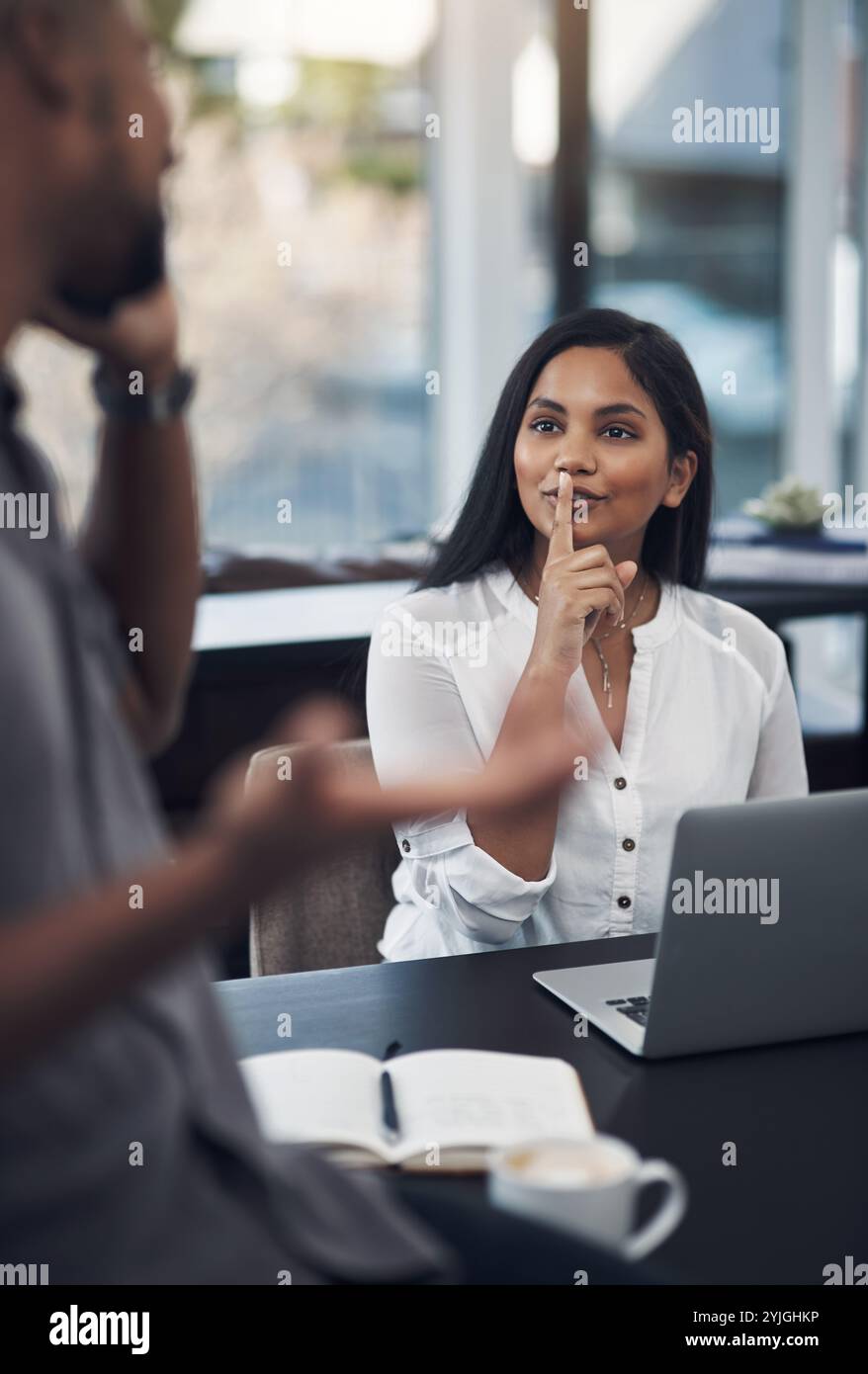 Woman, phone call and finger in office for quiet, man talking and emoji ...