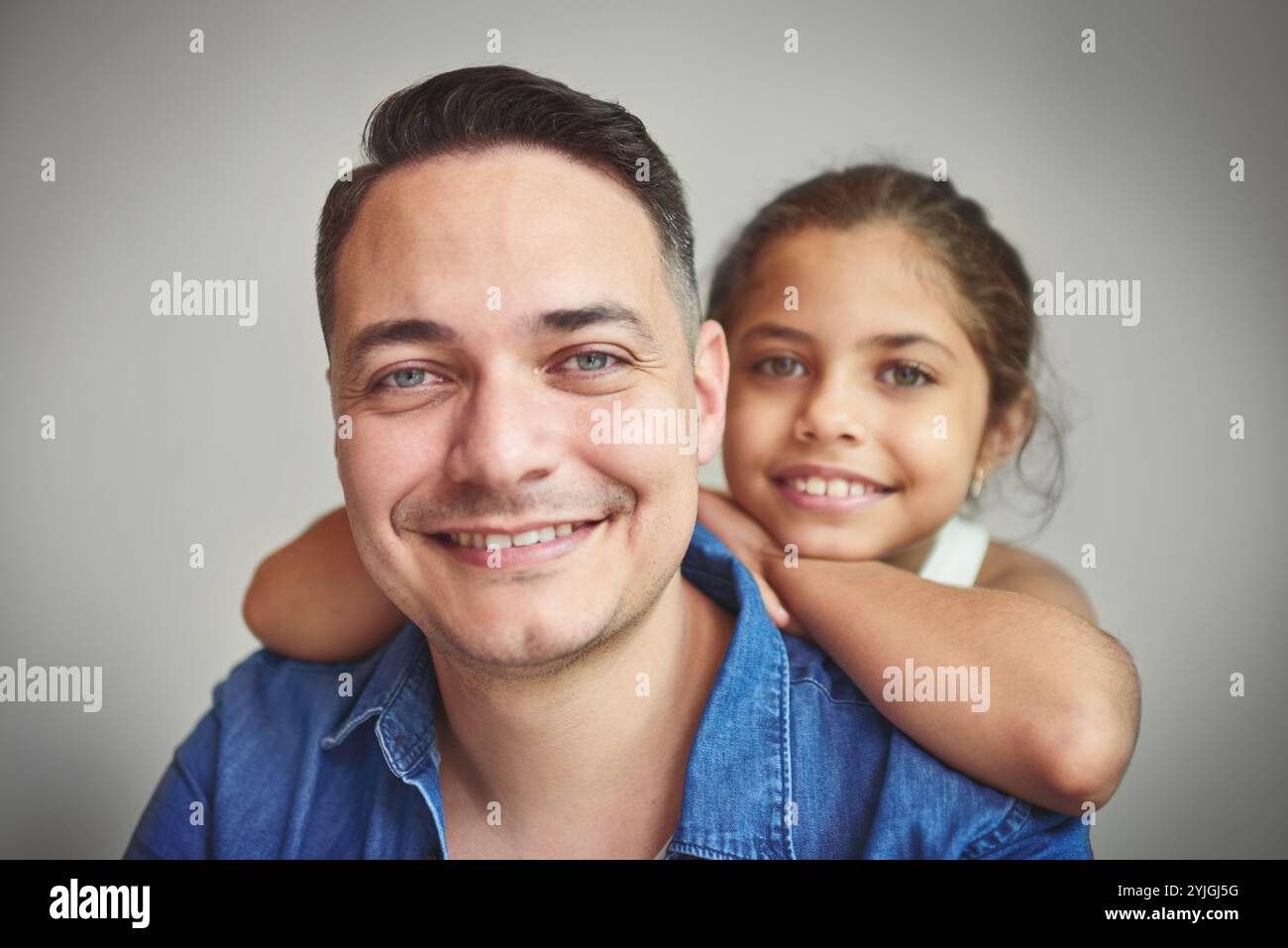 Portrait, father and daughter hug with love for affection, security and bonding together of ...