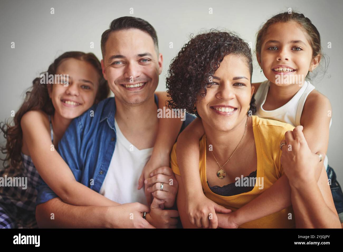 Portrait, parents and children with smile house for love, security and ...