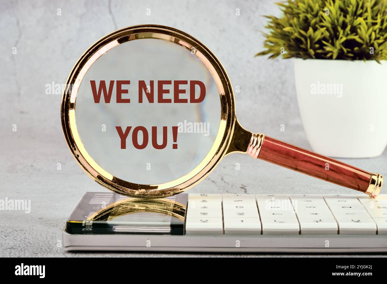 We need you symbol. Concept words WE NEED YOU through a magnifying ...