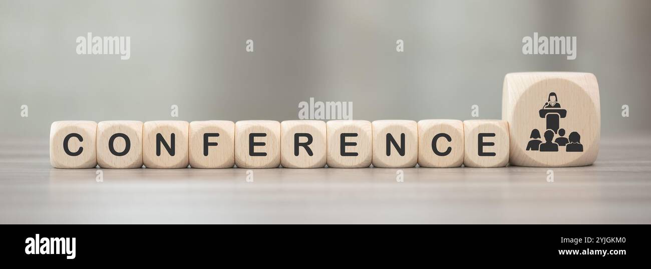 Wooden blocks with symbol of conference concept Stock Photo - Alamy