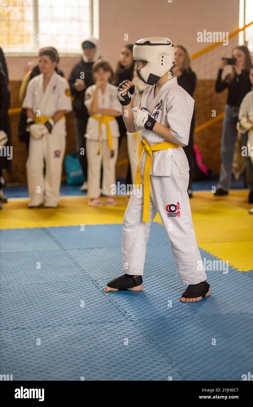 Kyiv. Ukraine 11.15.2024 Two karate kids fighting during championship ...