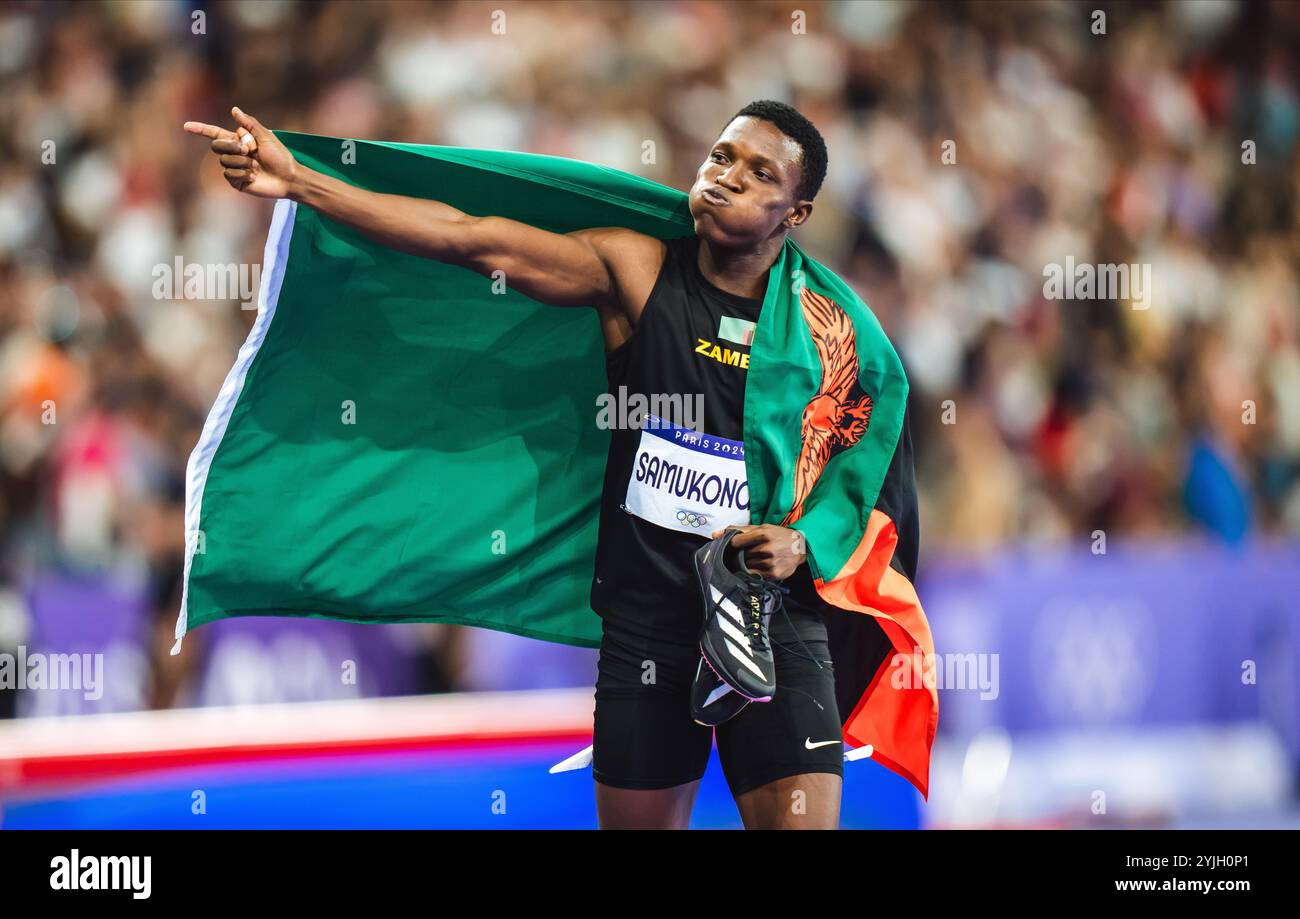 Muzala Samukonga celebrating her victory with her country's flag at the ...