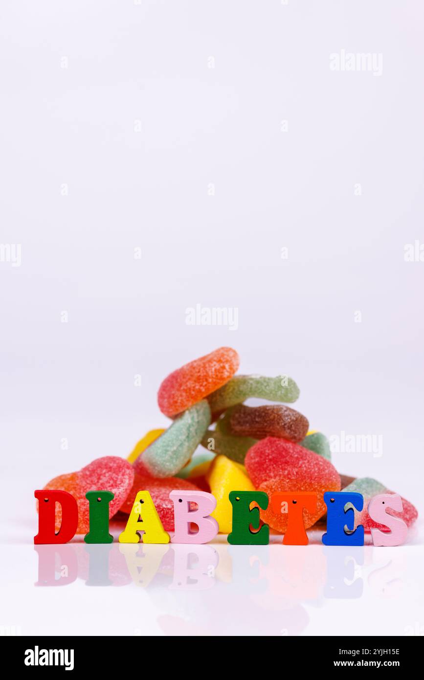 Wooden letters spelling "diabetes" in front of a mountain of colorful ...