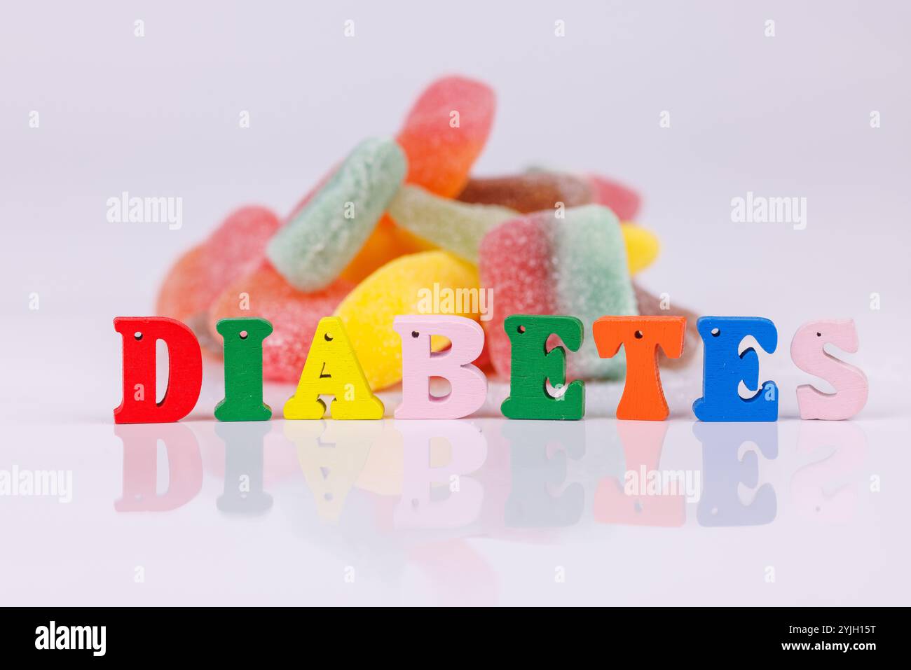 A close-up shot of wooden letters spelling "diabetes," with a pile of ...