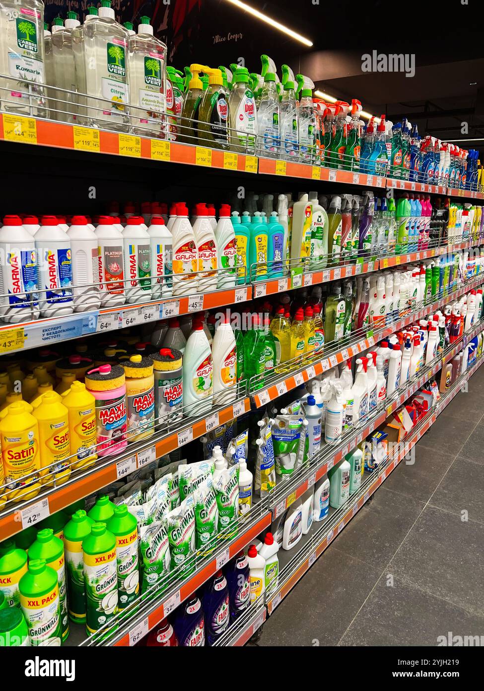 Kyiv, Ukraine - November 14, 2024: A supermarket aisle filled with diverse household cleaning ...