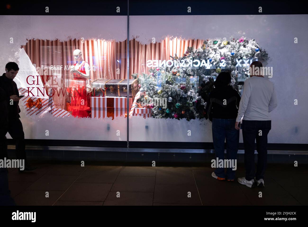 Christmas shoppers enjoy the John Lewis 2024 Christmas display windows ...