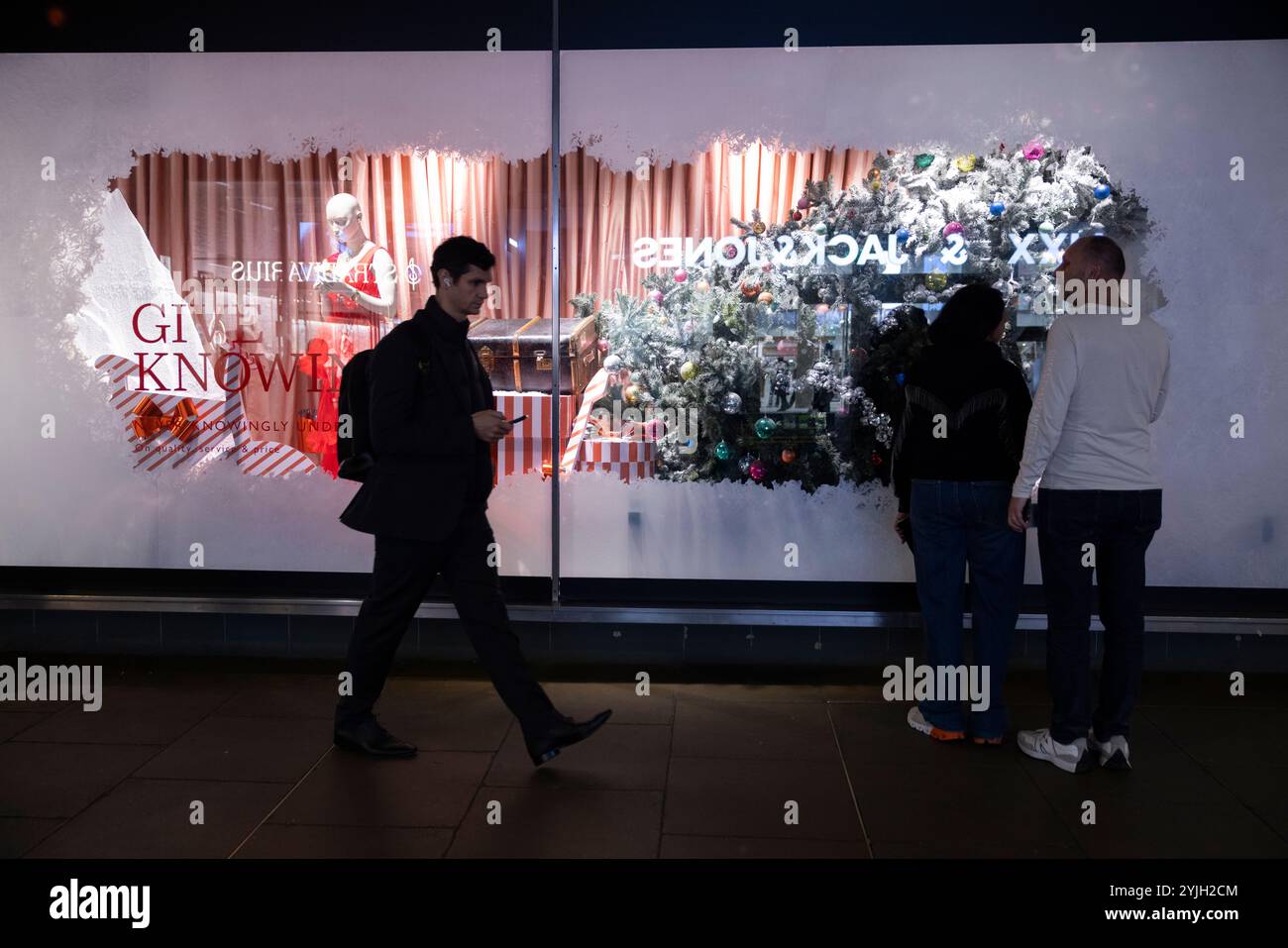 Christmas shoppers enjoy the John Lewis 2024 Christmas display windows ...
