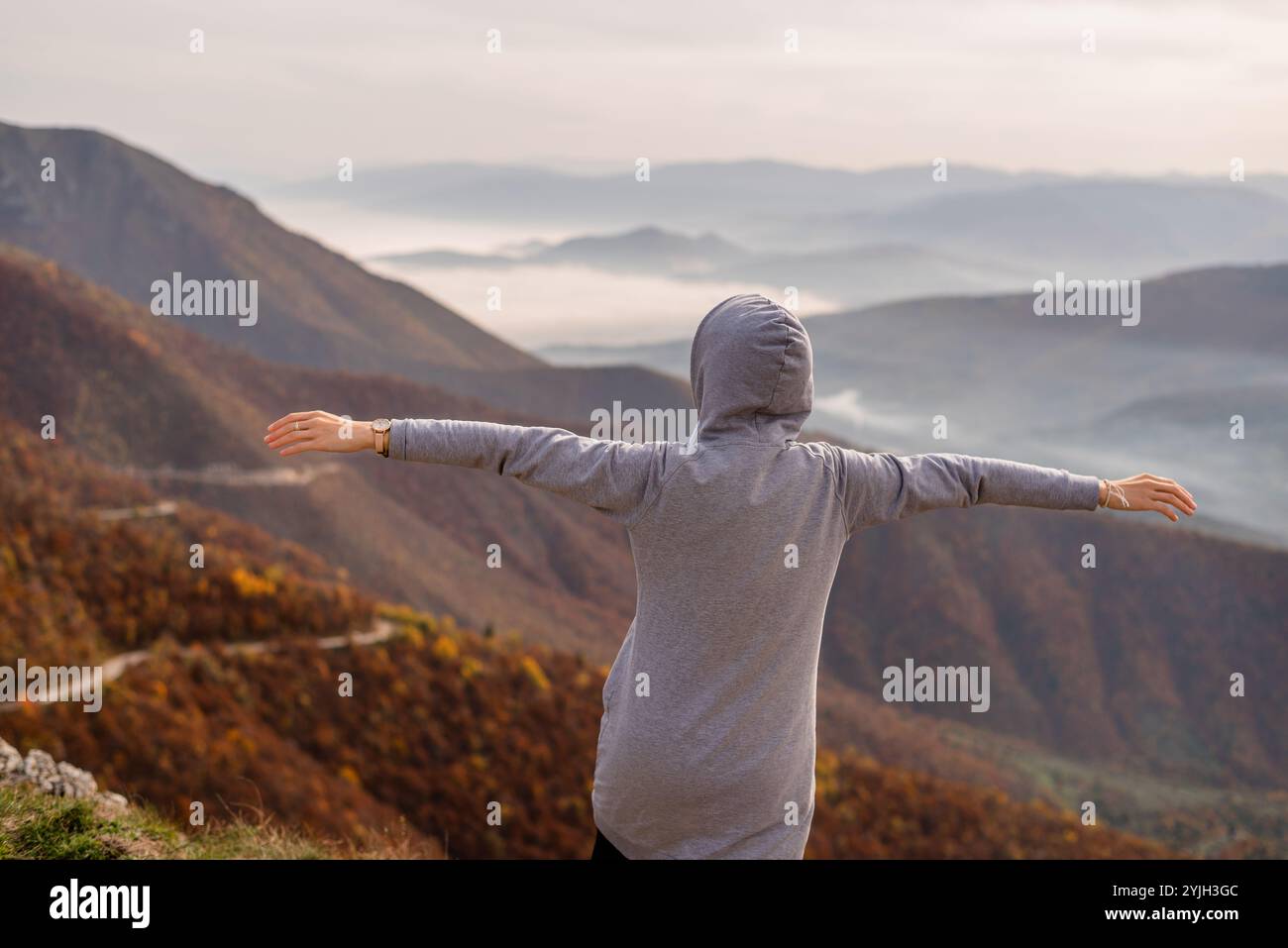 Happy woman enjoying rise hand open on top of mountain. Concept of free ...