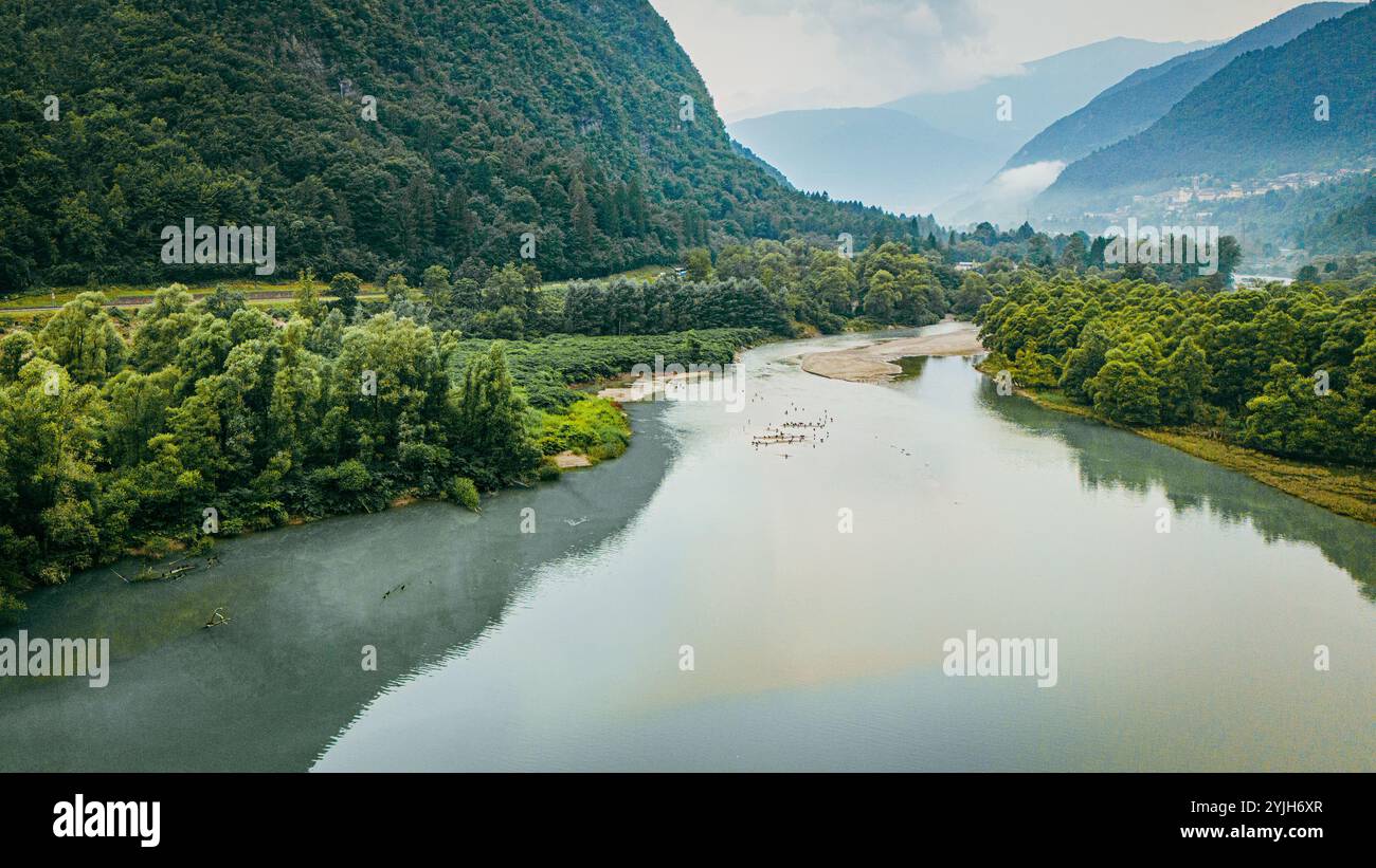 STENICO, ITALY – AUGUST 28, 2024: The serene Lago di Ponte Pià, nestled ...