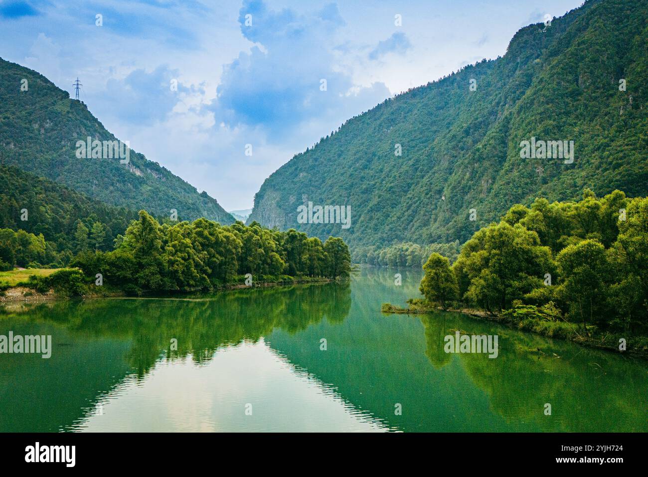STENICO, ITALY – AUGUST 28, 2024: The serene Lago di Ponte Pià, nestled ...