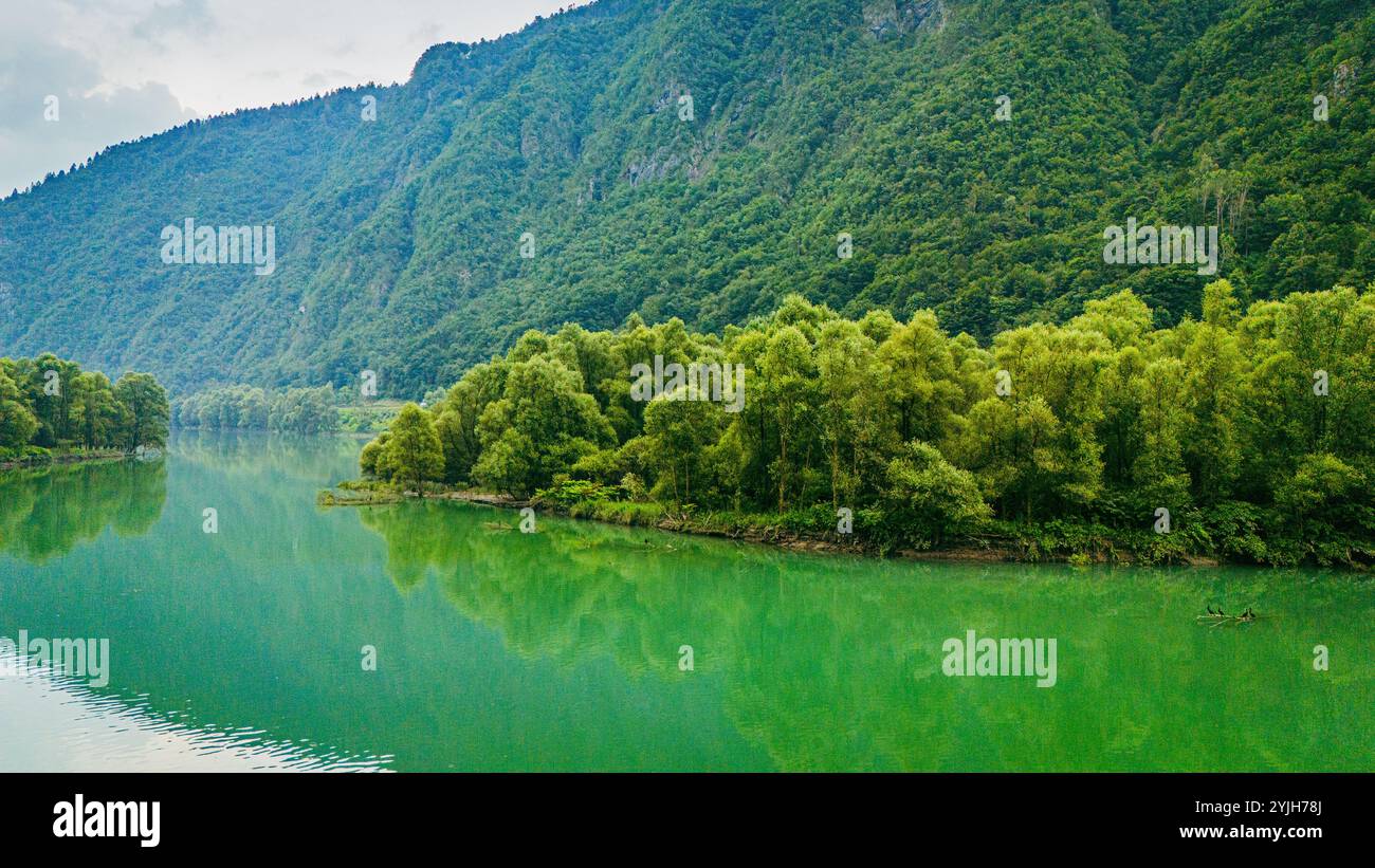 STENICO, ITALY – AUGUST 28, 2024: The serene Lago di Ponte Pià, nestled ...