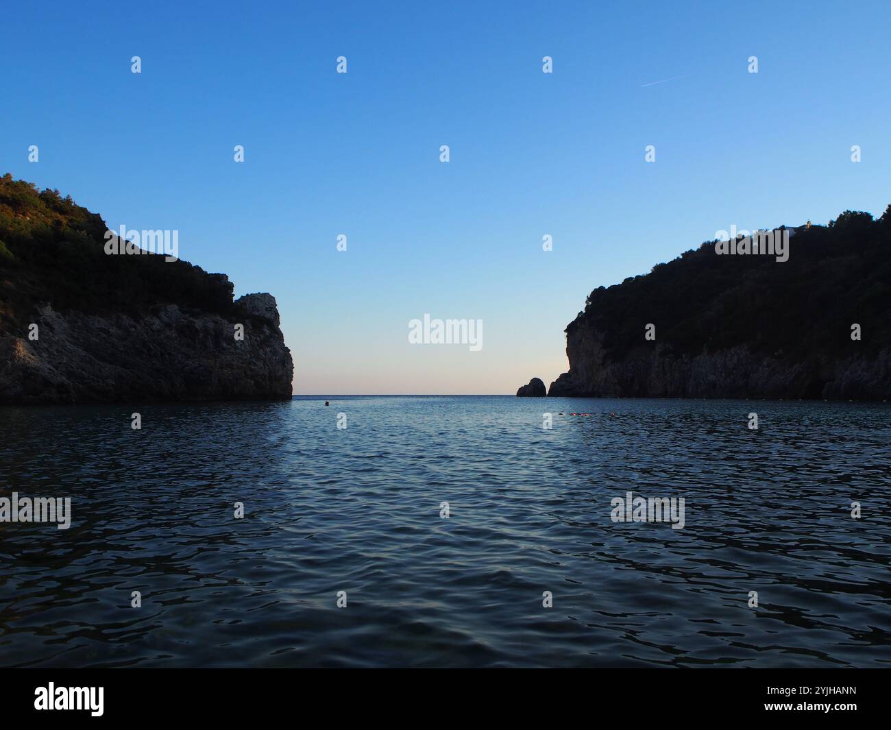 Water passage between two cliffs in Corfu, Greece Stock Photo - Alamy